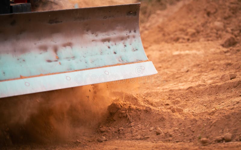 Construction Tractor with Specialized Dozer Blade Pushing and Grading ...