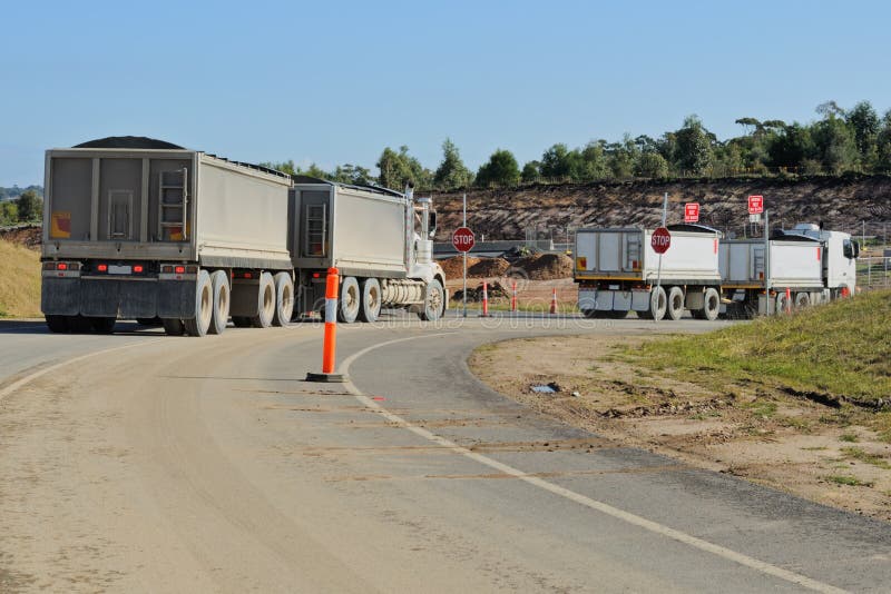 Construction Trucks at Turn Stock Photo - Image of road, work: 26138092