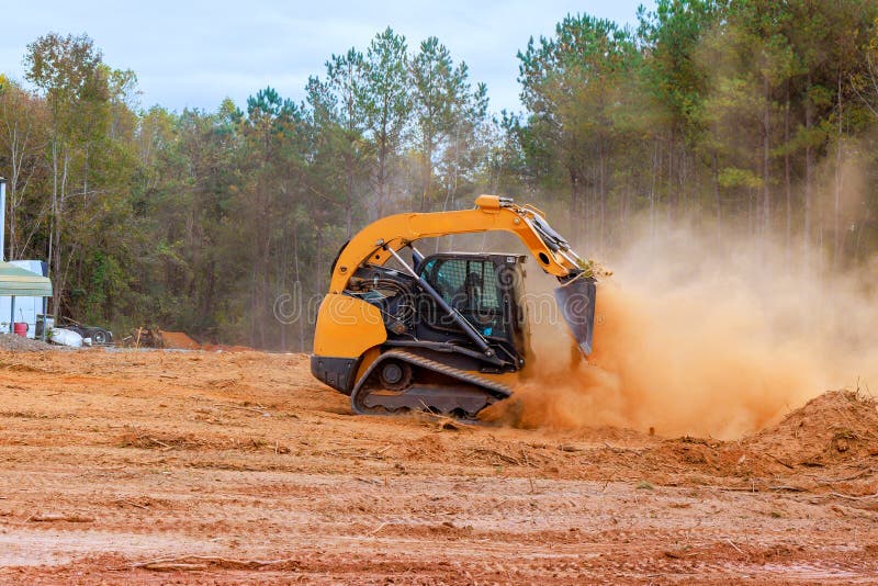 Heavy Machinery Clears Land at Construction Site in Rural Area during ...