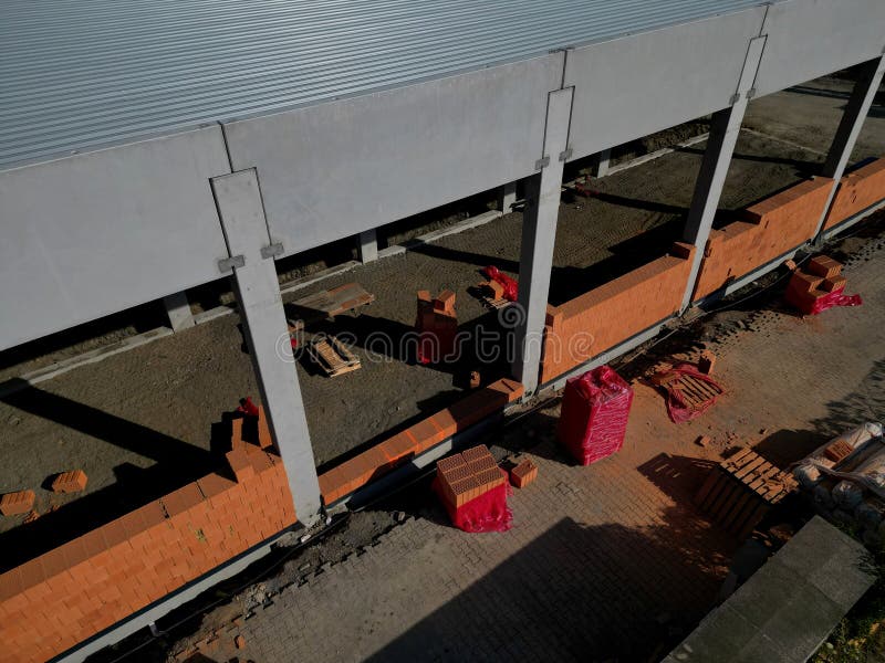 Construction of the Wall of Warehouse Building. between Columns Stock ...