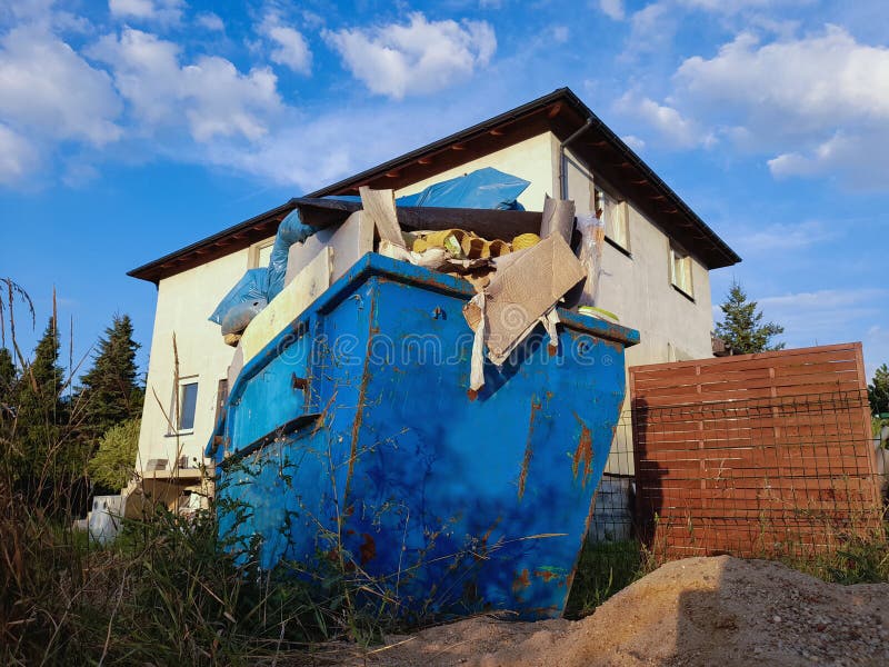 Construction Waste Container Full. on Construction Site Stock Photo ...