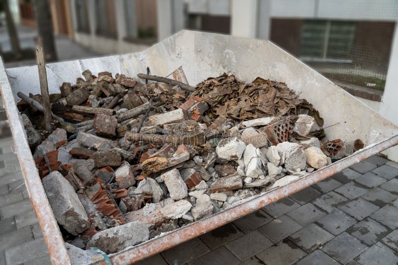 Construction Waste and Debris on the Streets in the Metal Container ...