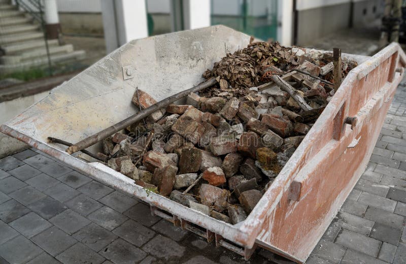 Construction Waste and Debris on the Streets in the Metal Container ...