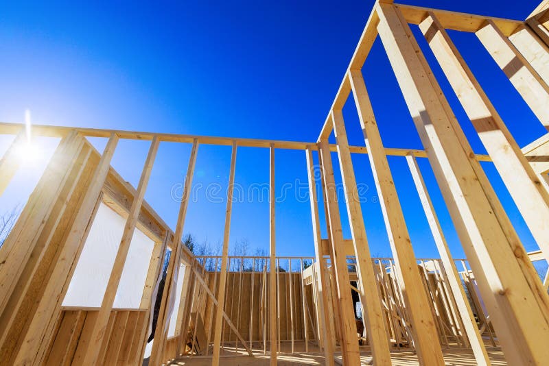 Construction of a Wooden Frame Structure Under Clear Blue Skies in a ...