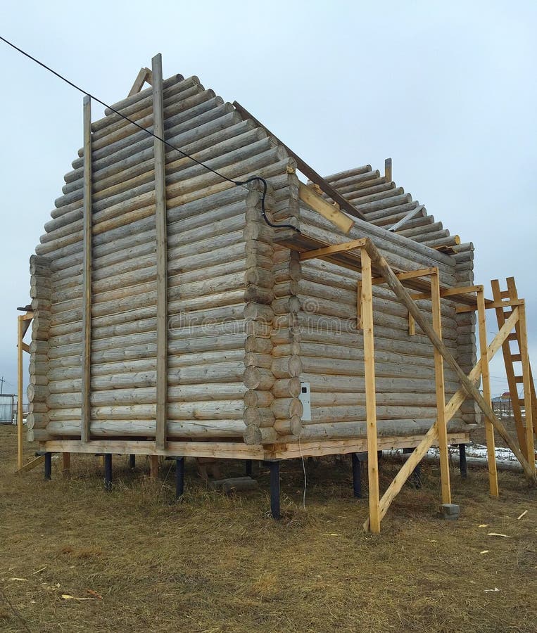 Construction of a Wooden House from Whole Logs Stock Image - Image of ...