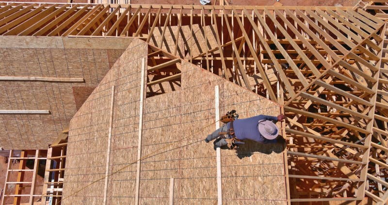 Construction of a Wooden Roof Beam into a Newly Built Stick Home Using ...
