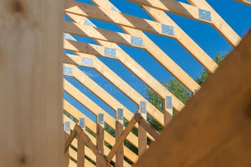 Construction of a Wooden Roof Framework Under Clear Blue Skies Stock ...
