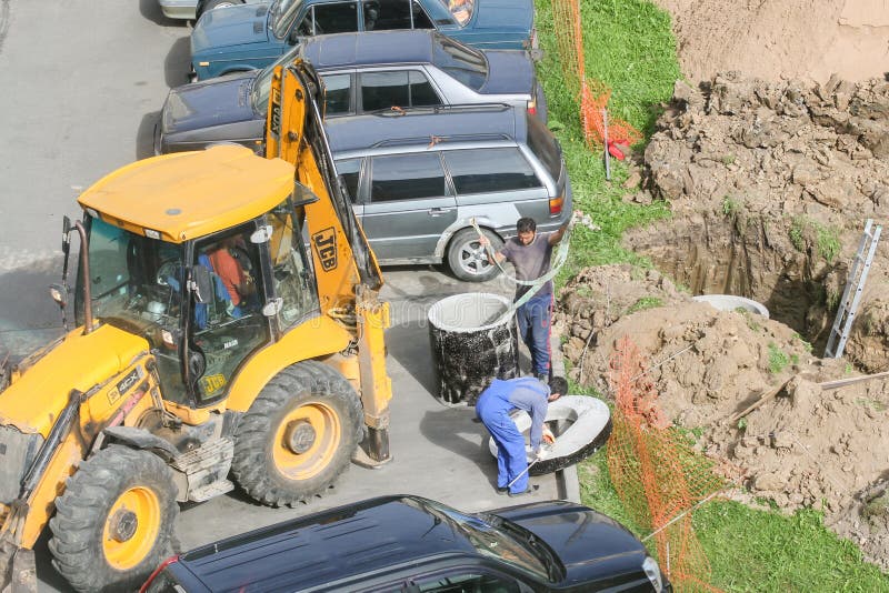 Construction Work between Cars Editorial Photography - Image of tractor ...