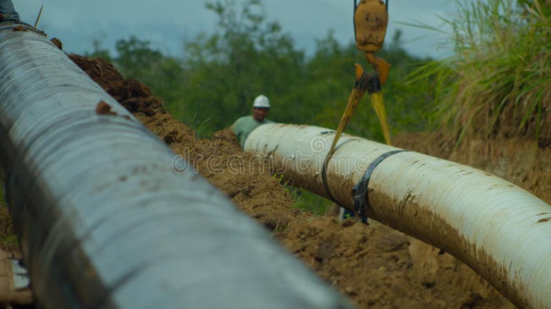 Construction Work- the Crane Lifting the Beam in the Field and the ...