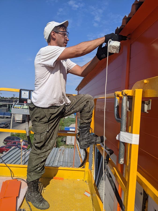 Construction Work, Fastening of the Facade and Roof Stock Photo - Image ...