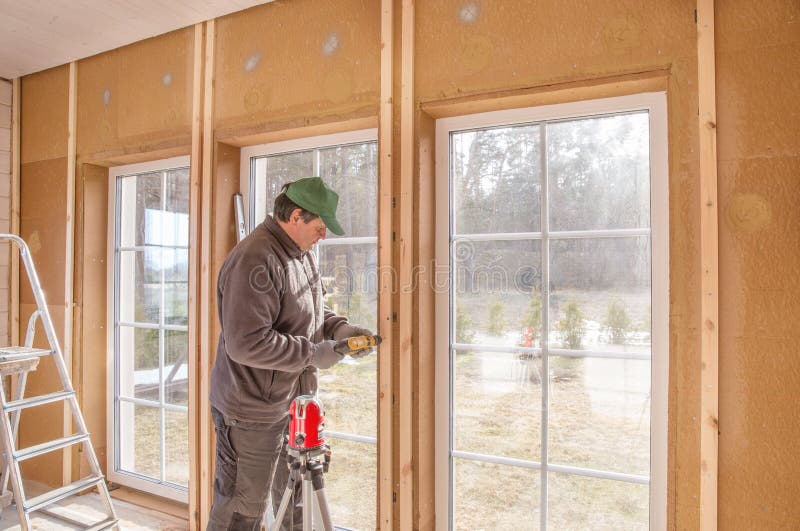 Construction Work, Finishing Work in a Wooden House and Installing ...