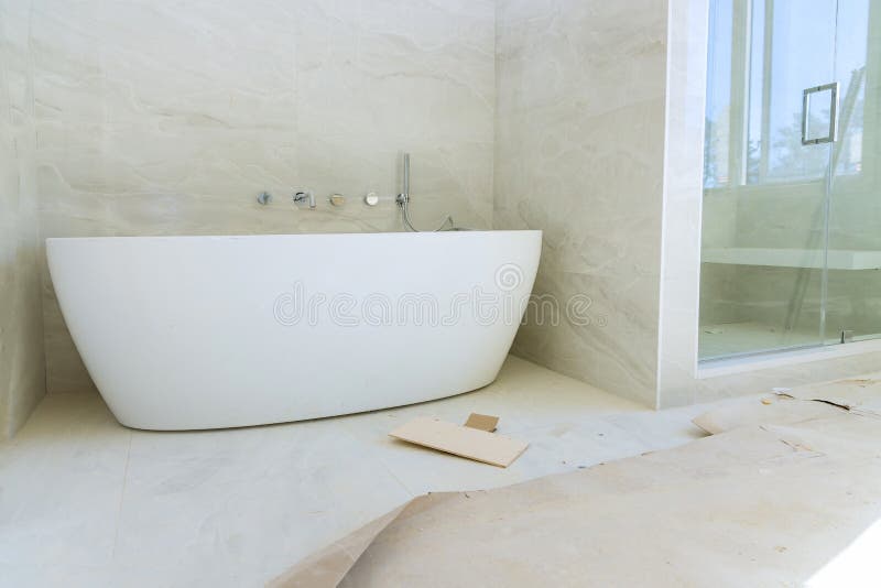 Construction Work Installing Ceramic Tile on Reconstruction of Bathroom ...