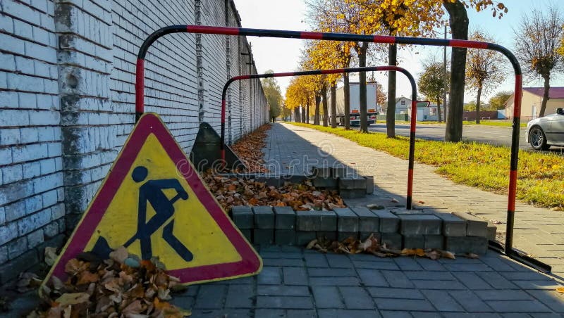 Construction Work Obstructs Sidewalk Along Tree-lined Street in Autumn ...
