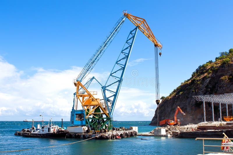 Construction work in port stock photo. Image of harbor - 142192164