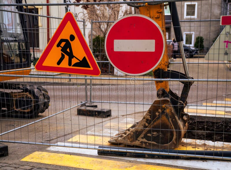 Construction Work in Progress with Warning Signs and Equipment on City ...