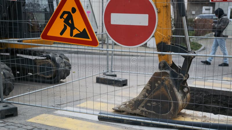 Construction Work in Progress with Warning Signs and Equipment on City ...