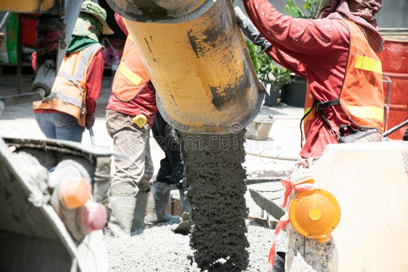 Construction Work is Still Ongoing, Such As Pouring Concrete Stock ...