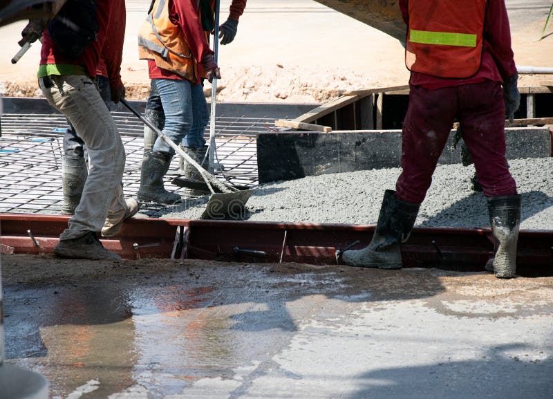 Construction Work is Still Ongoing, Such As Pouring Concrete Stock ...