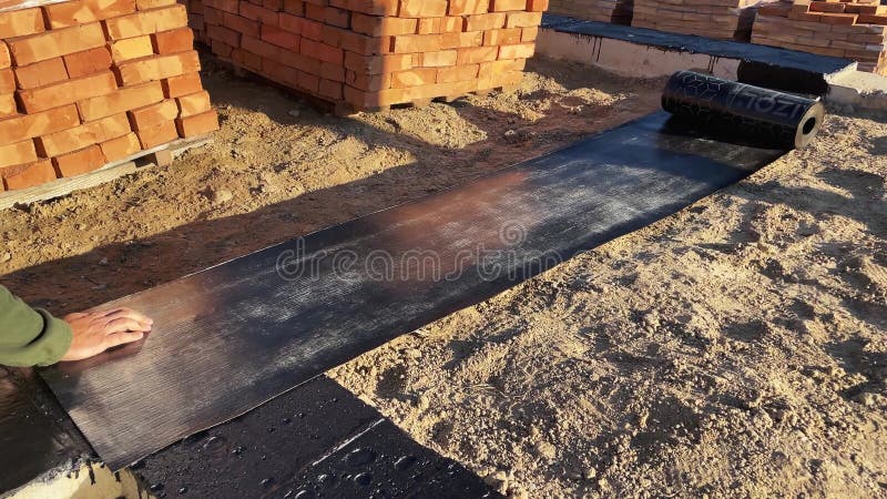 Construction Work on Waterproofing the Foundation. Roll Waterproofing ...