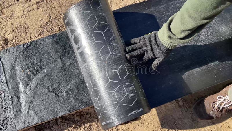 Construction Work on Waterproofing the Foundation. Roll Waterproofing ...