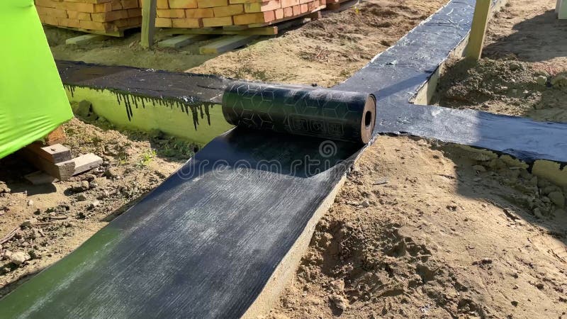 Construction Work on Waterproofing the Foundation. Roll Waterproofing ...