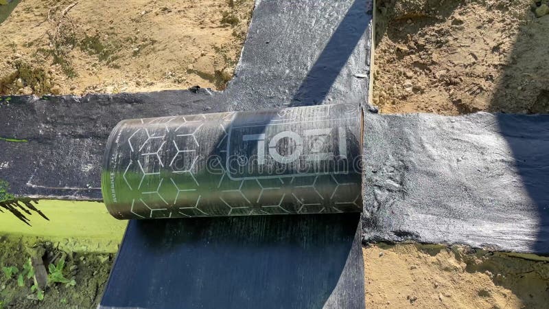Construction Work on Waterproofing the Foundation. Roll Waterproofing ...