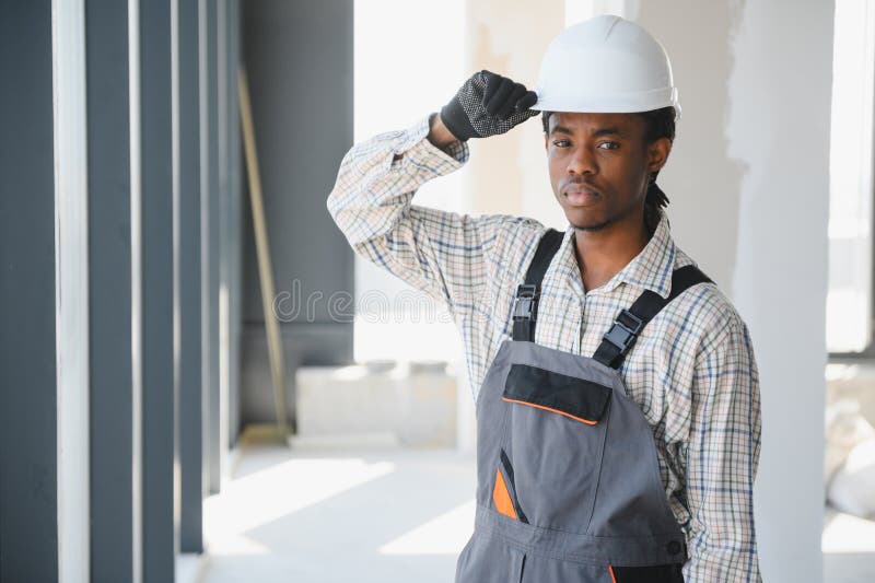 Construction Worker Adjusting Hardhat on Building Site Stock Photo ...