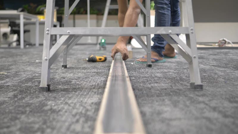 Construction Worker Aligning Metal To Partition Foundation Stock Video ...