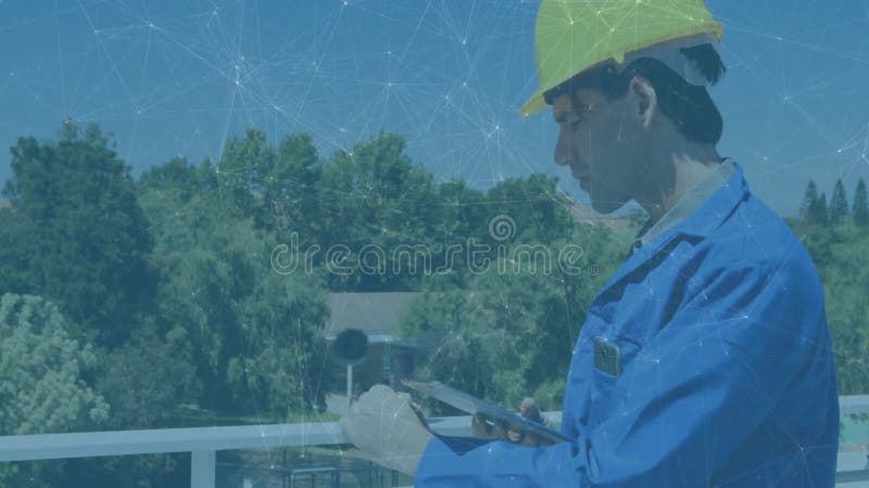 Construction Worker Analyzing Smart Tablet Data on Platform, Showing ...