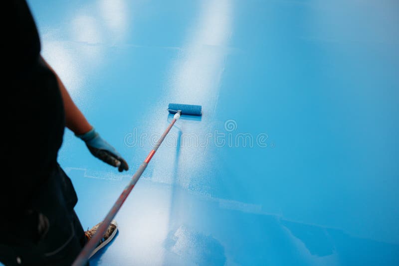 Construction Worker Applying Epoxy Resin on Rubber Flooring Stock Image ...