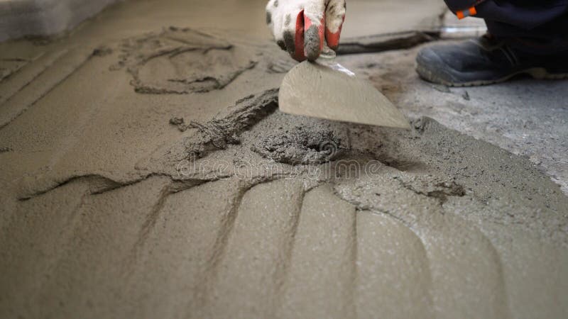 Construction Worker Applying Cement Glue Mixture on Wall with Notched ...