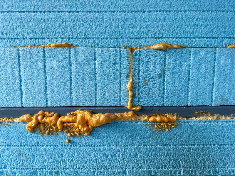 Construction Worker Applying Expanding Foam Insulation on Blue Xps ...