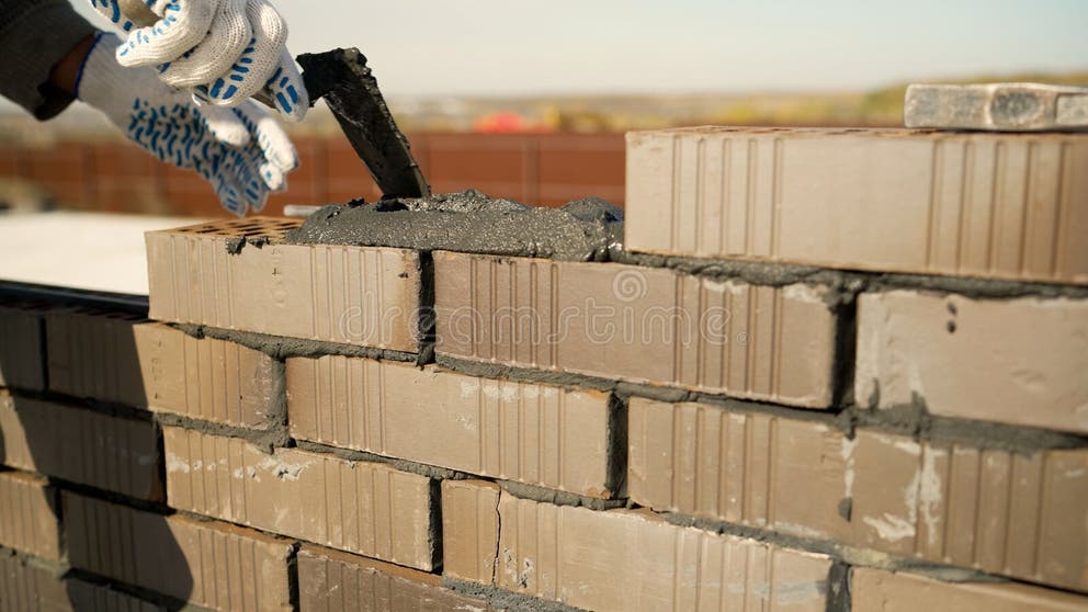 Construction Worker Building a Wall with Bricks and Mortar Stock Image ...
