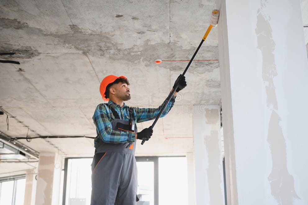 Construction Worker Applying Plaster on Walls and Ceilings Using ...