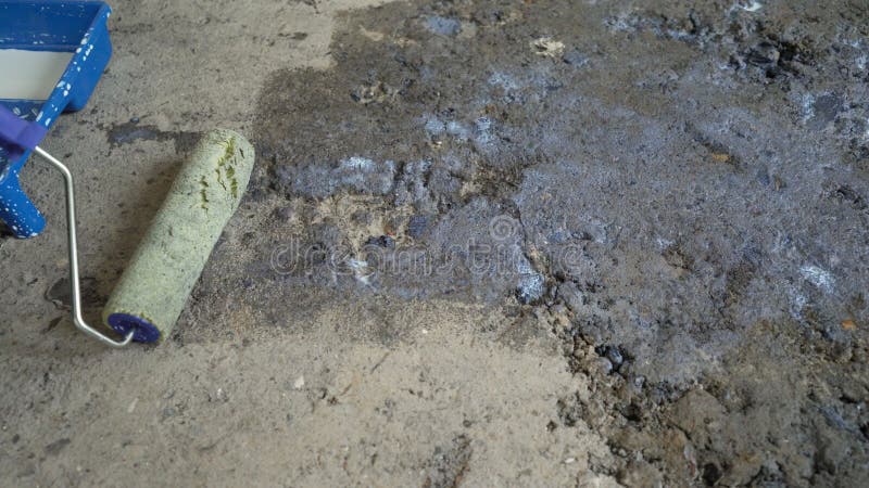 Construction Worker Applying Primer on Concrete Floor. Stock Photo ...