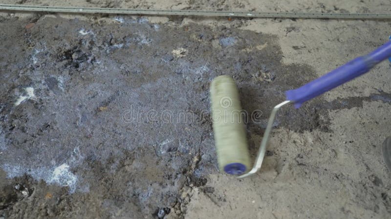 Construction Worker Applying Primer on Concrete Floor. Stock Footage ...