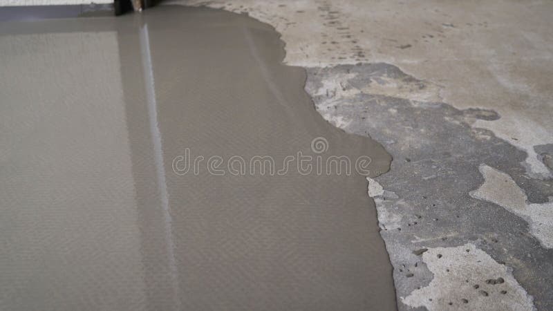 Construction Worker Applying Self-leveling Concrete on Damaged Floor ...