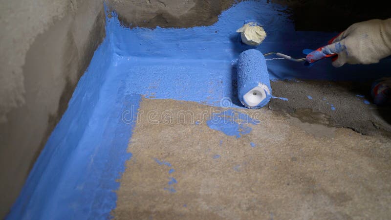 Construction Worker Applying Waterproofing Material with Paint Roller ...