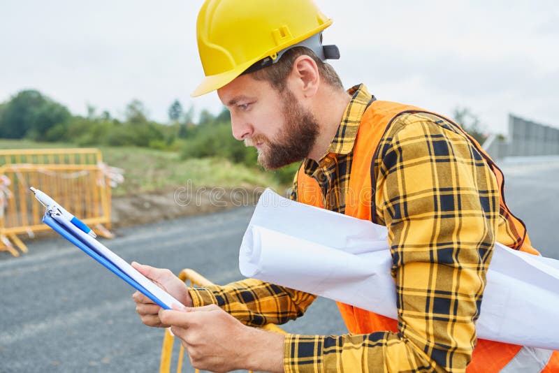 Construction Worker As Foreman with Checklist and Blueprint Stock Photo ...