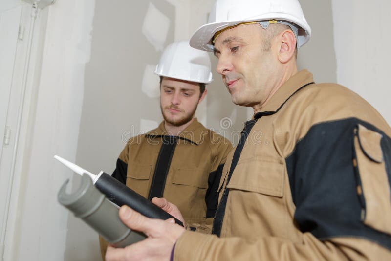 Construction Worker Assembling Silicone Gun Stock Image - Image of ...