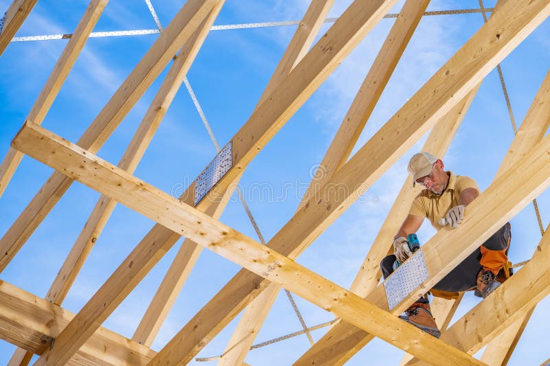 Construction Worker Assembling Wooden Framework Under Blue Sky Stock ...