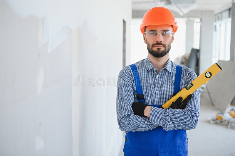 Construction Worker in Blue Uniform with Spirit Level Stock Image ...