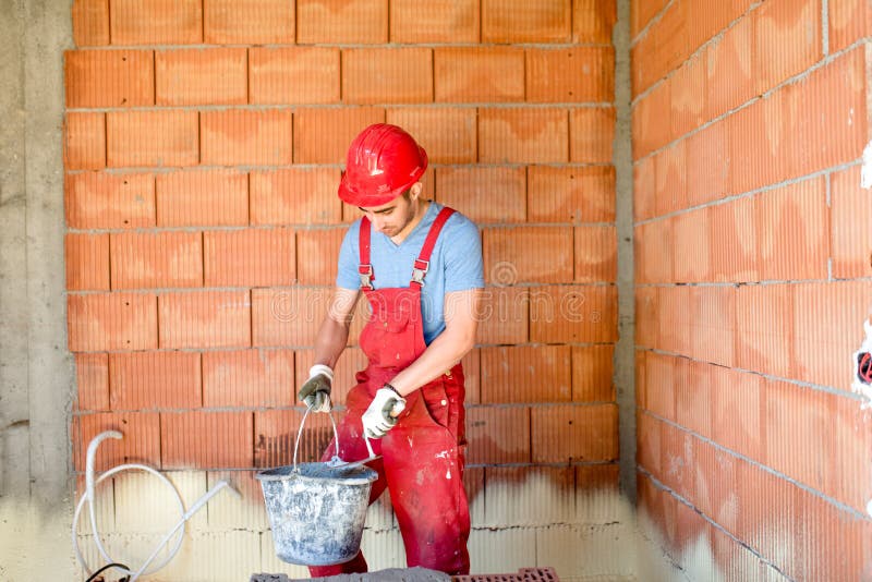 Construction Worker, Builder, Working on Construction Site. Stock Photo ...