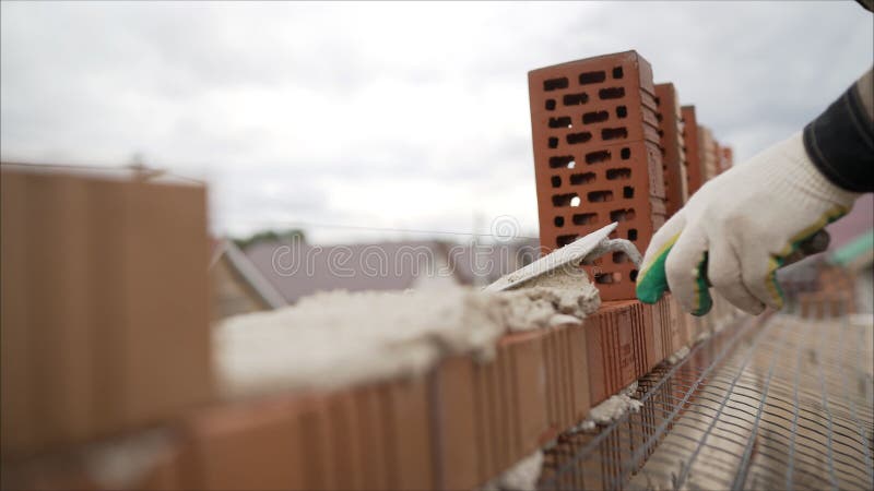Construction Worker Applying Cement with Trowel on Brick Wall Stock ...