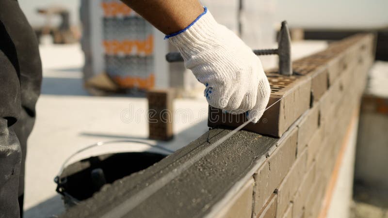 Construction Worker Building a Brick Wall Using String As Guide Stock ...