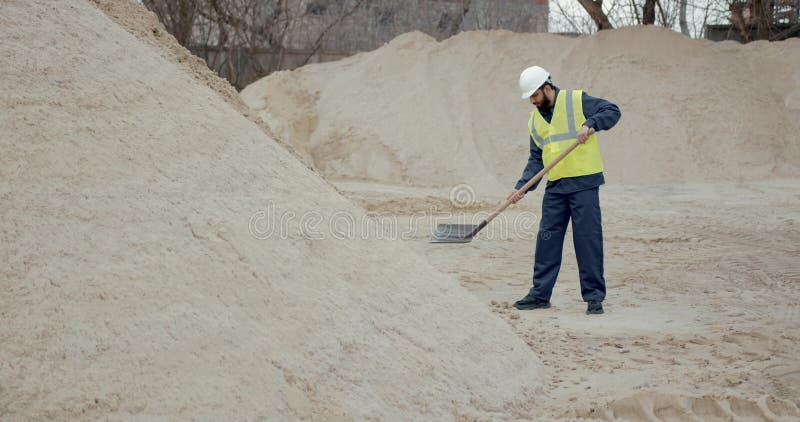 Manual Worker Digging Sand with Shovel at Building Site Stock Video ...