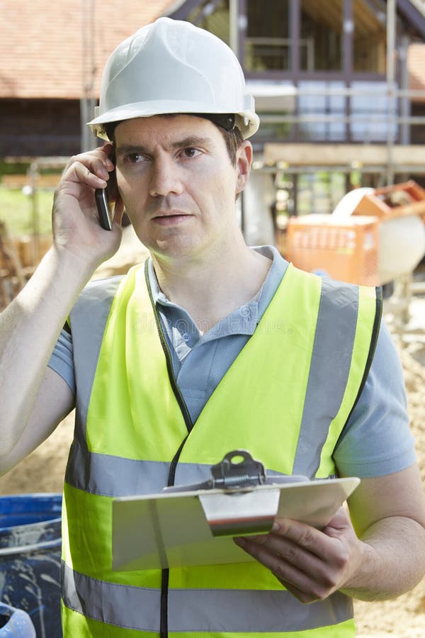 Construction Worker on Building Site Using Mobile Phone Stock Image ...
