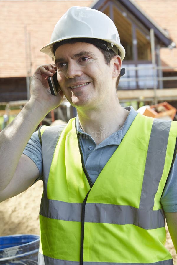 Construction Worker on Building Site Using Mobile Phone Stock Photo ...