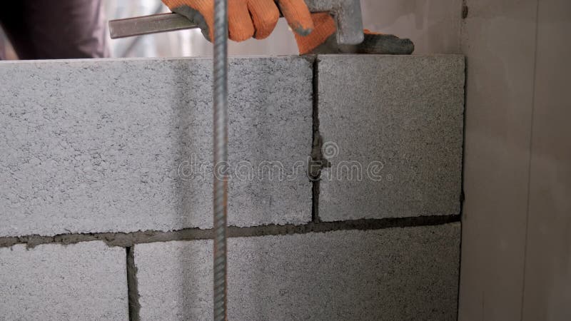 Construction Worker Building a Wall with Concrete Blocks Close Up Stock ...