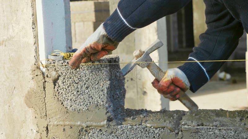 Construction Worker Builds Brick Wall, Closeup View at Construction ...